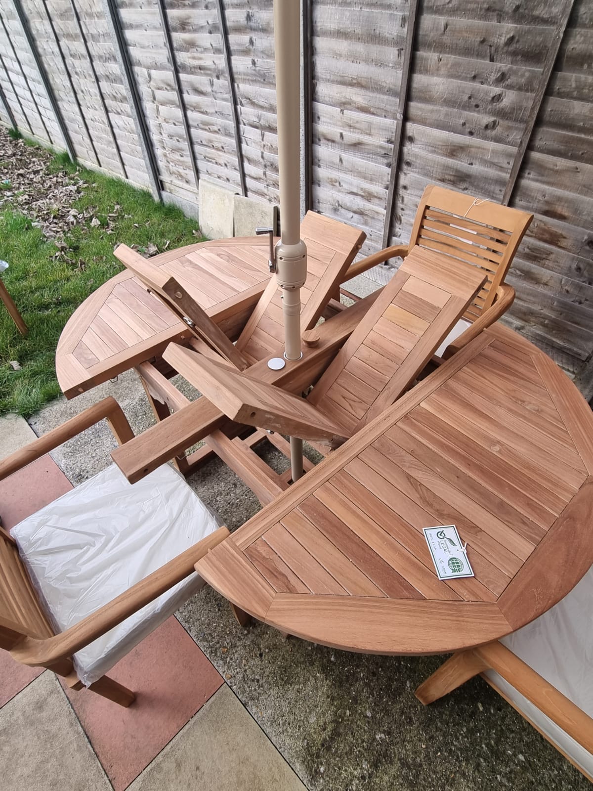 Teak Garden Dining Set. Table 6 chairs cushions and parasol.